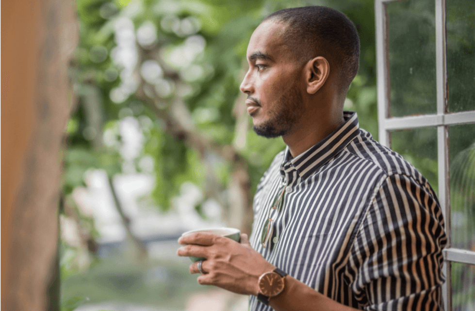 An image of a person with a cup of tea